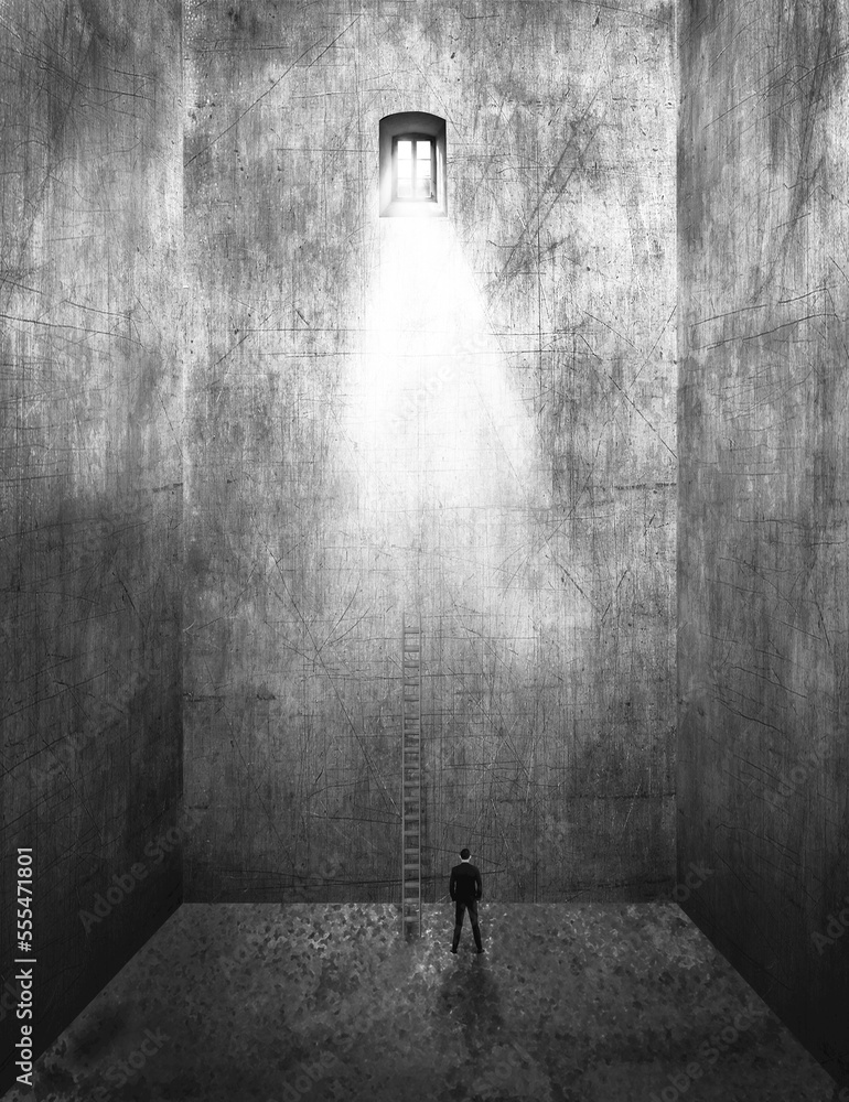 Image of a man standing in an empty room with tall walls and a ladder ...