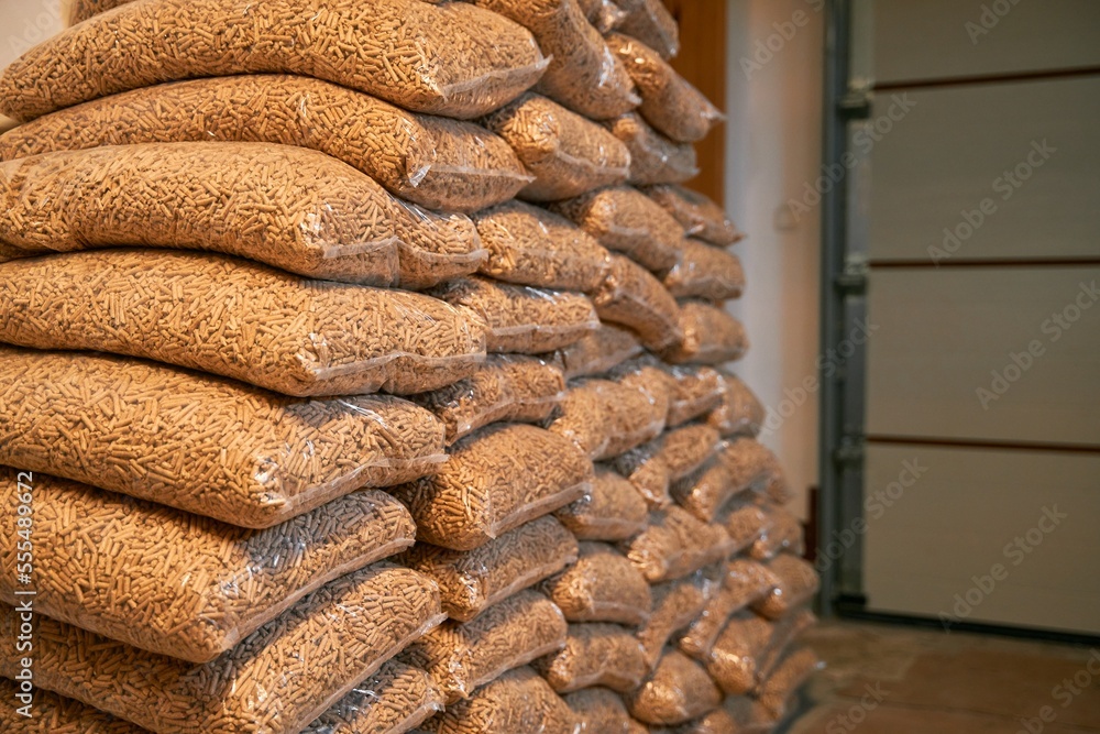 A massive stack of wooden pellets. Eco fuel for house heating ...