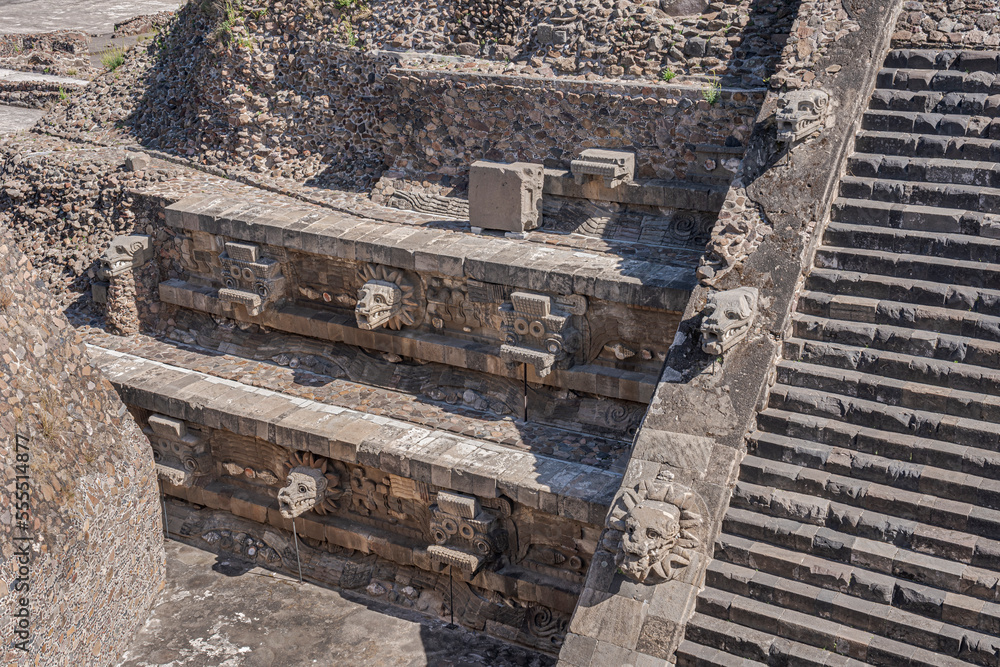 Carved heads depicting feathered snake heads in the Quetzalcoatl temple ...