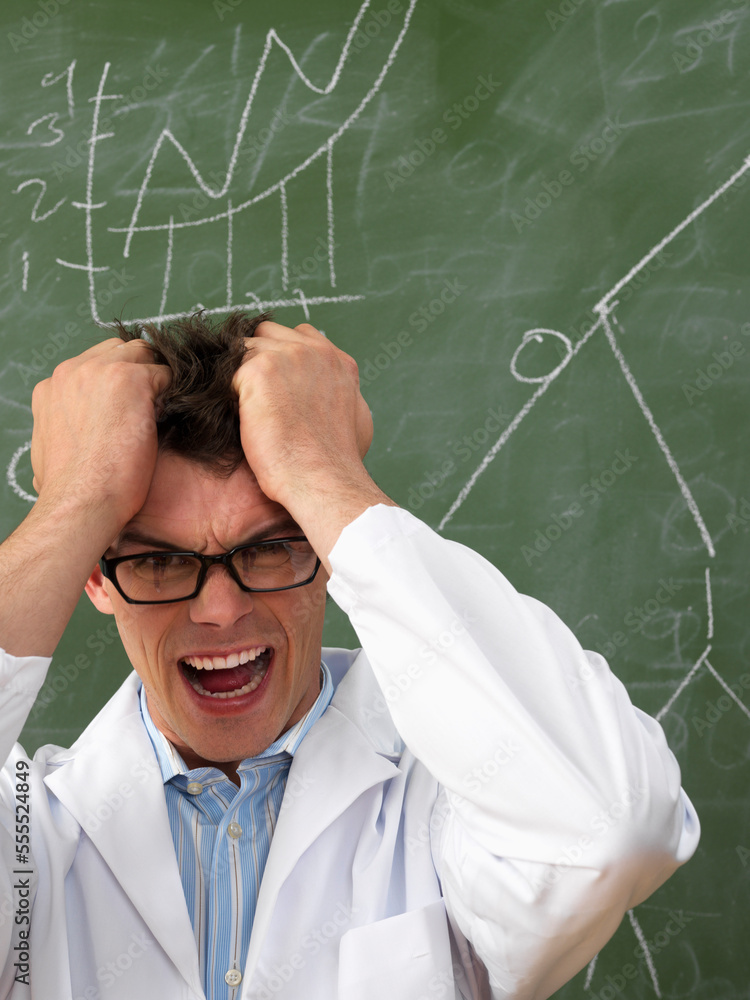 Confused Scientist in Front of Blackboard Stock Photo | Adobe Stock
