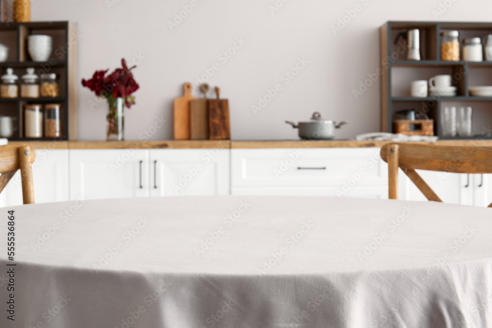 Empty dining table in light kitchen Stock Photo | Adobe Stock