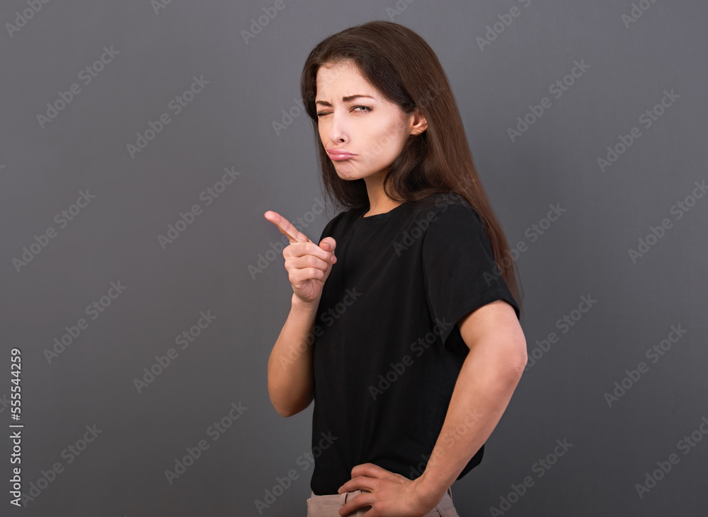 Anger casual woman pouted her lips and shaking the finger with strict ...