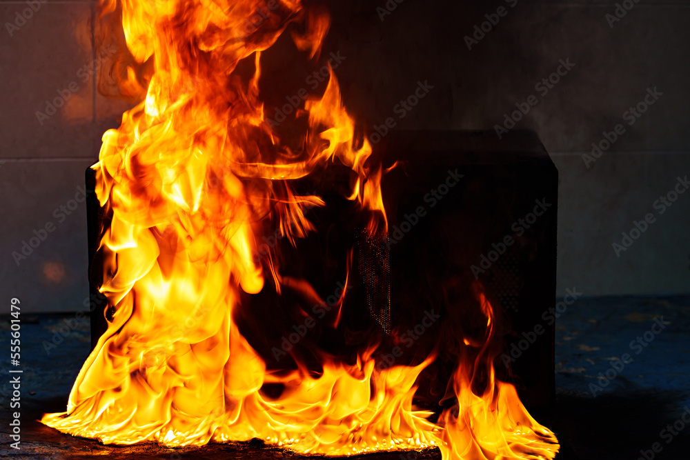 microwave oven on fire. the concept of fire in the kitchen and ...
