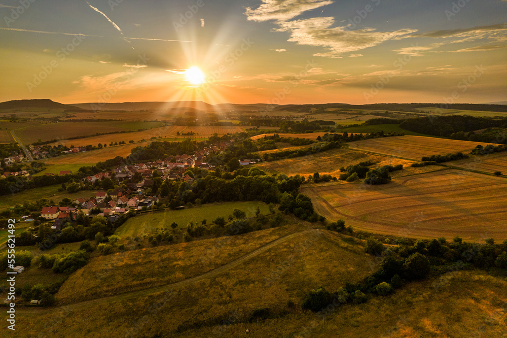 Aer ial view of a German village surrounded by meadows, farmland and ...