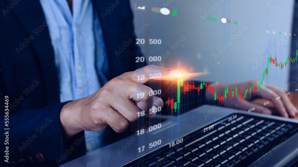 Businessman finger touch symbol stock graph and chart background ...