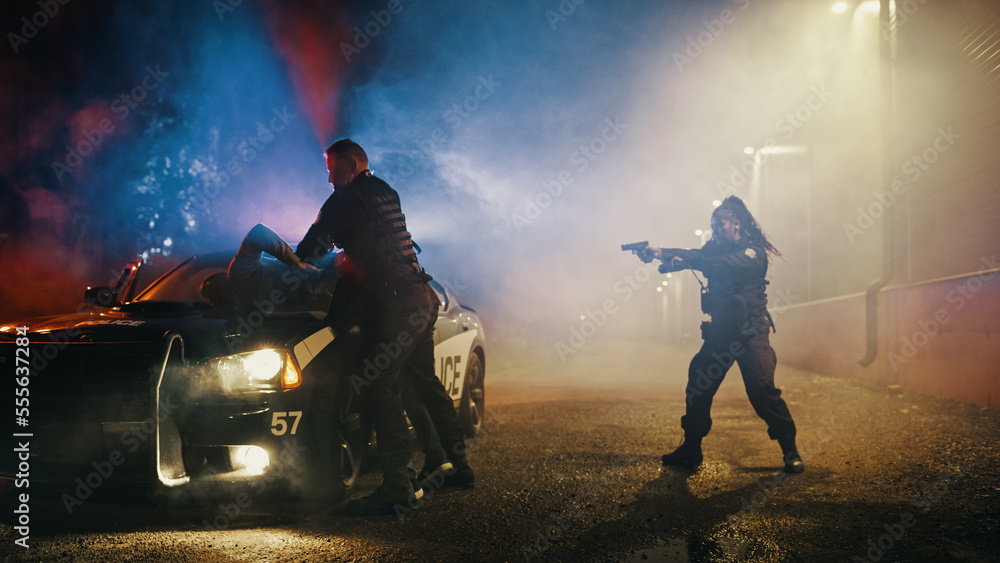 Male Policeman Forcing a Compliant Civilian on the Hood of Police Car ...
