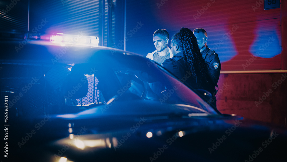 Two Police Officers Arrest Suspect, Put Him in Patrol Сar. Officers of ...