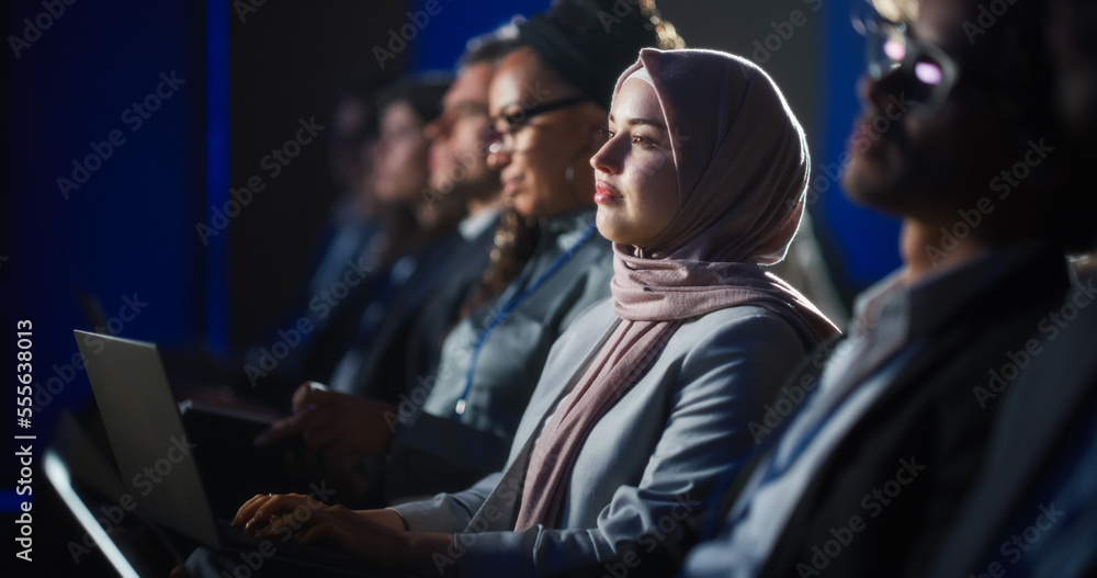 Arab Female Sitting in a Dark Crowded Auditorium at a Human Rights ...