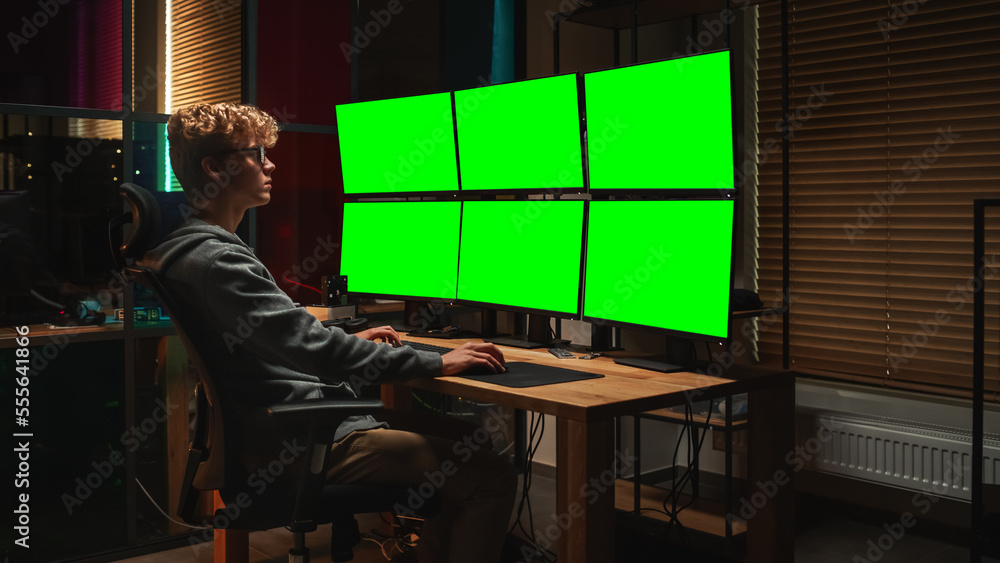 Young Caucasian Man Writing Code on Professional Six Monitors Setup ...