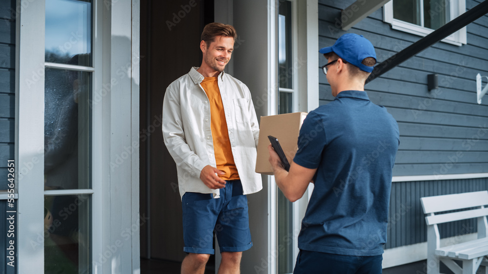Handsome Young Homeowner Receiving an Awaited Parcel from a Cheerful ...