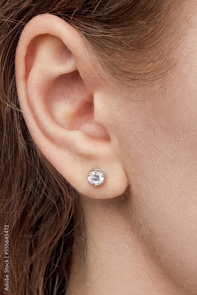 isolated on white background jewelry gold and silver stud earrings with ...