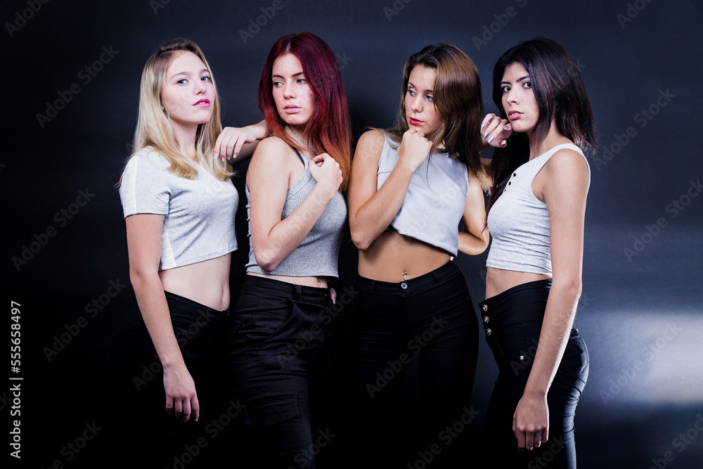 Group of teenage girls on a studio photoshoot. Young women photoshoot ...