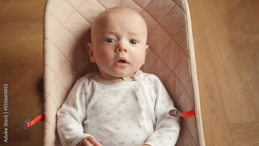 Video Stock newborn baby in a rocking chair. happy family kid dream ...