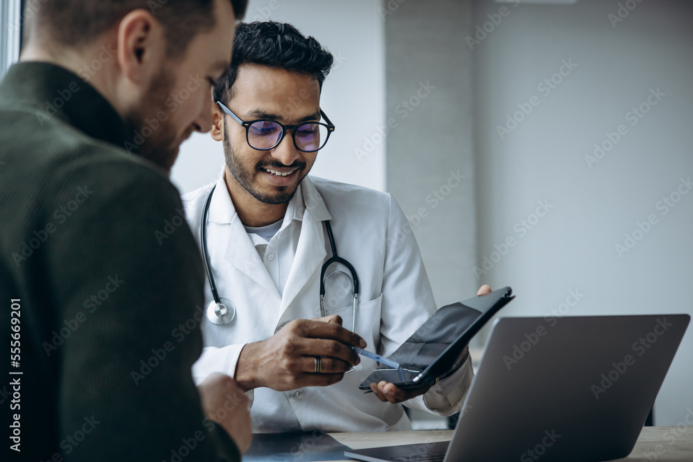 Patient having a visit at doctor making check-up Stock Photo | Adobe Stock