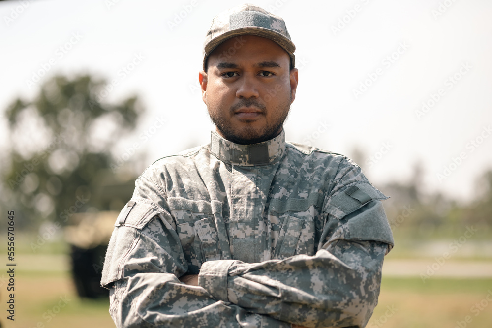 Asian man special forces soldier standing against on the field Mission ...