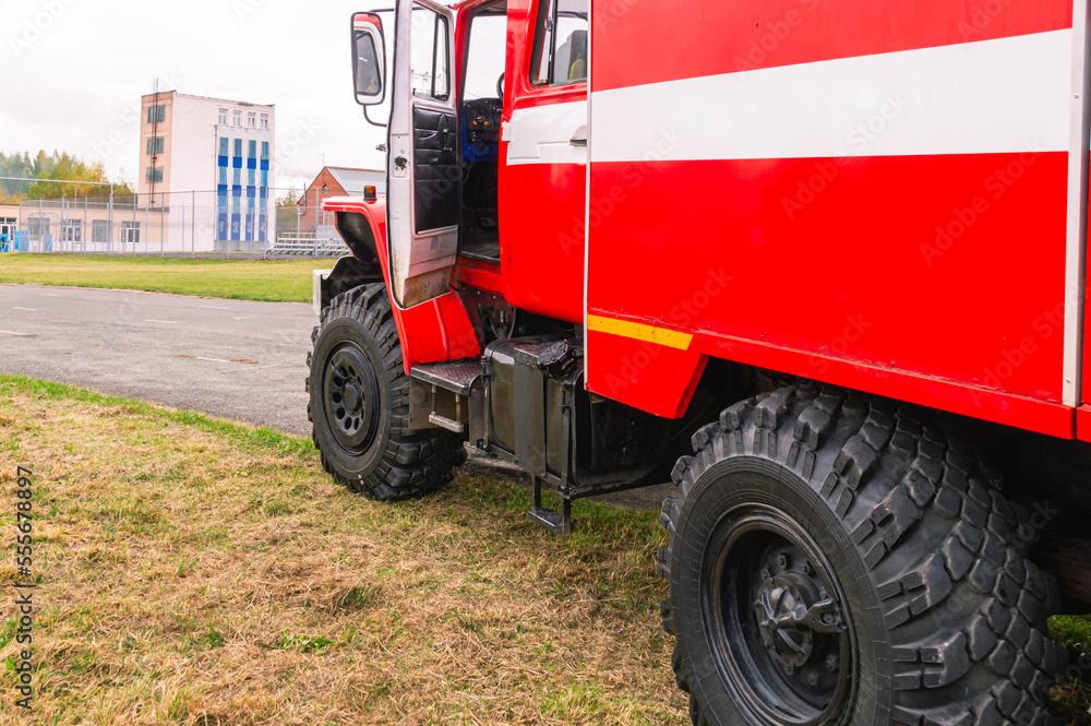 A fire truck with increased cross-country terrain. Side view of a fire ...