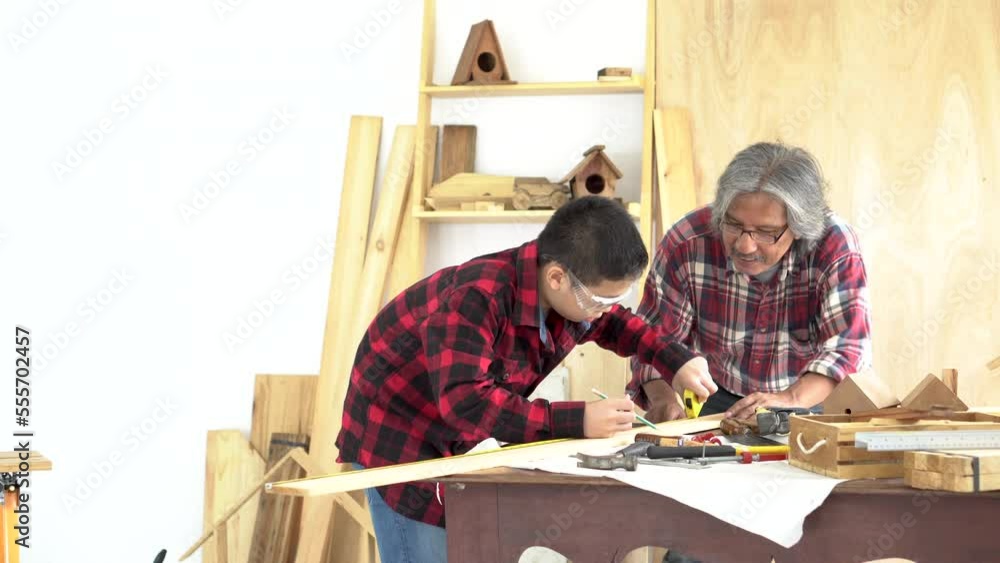 Asian pre-teen boy help grandfather work woodwork, teenager boy taking ...