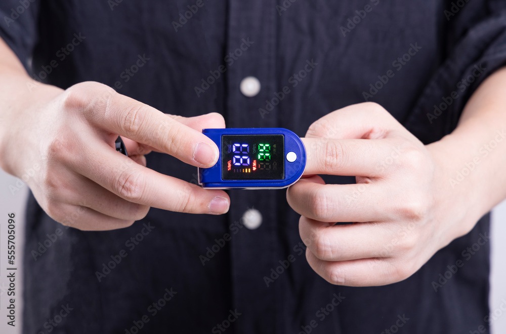 Blood oxygen saturation was measured with a pulse oximeter Stock Photo ...