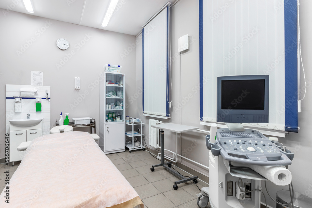 Interior of hospital room with ultrasound machine and bed Stock Photo ...