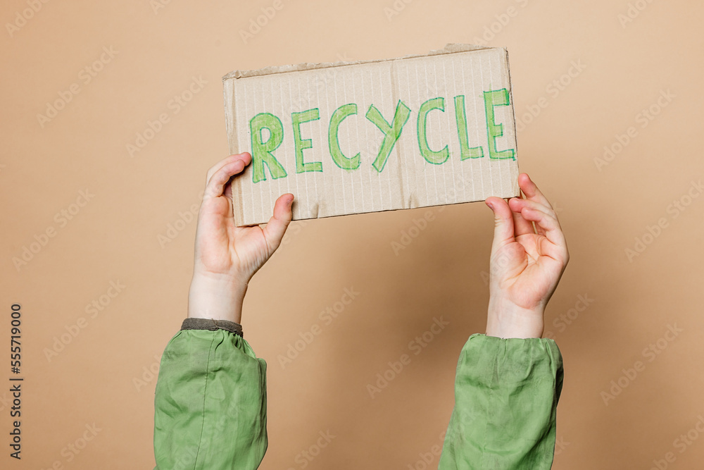 Crop child showing Recycle poster Stock Photo | Adobe Stock