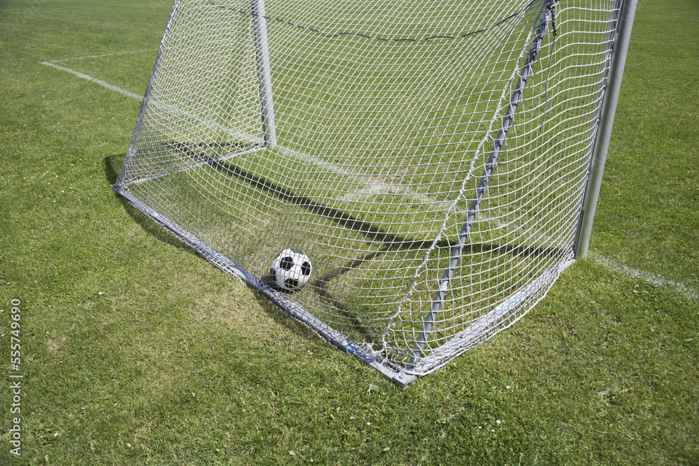 Soccer Ball in Net Stock Photo | Adobe Stock