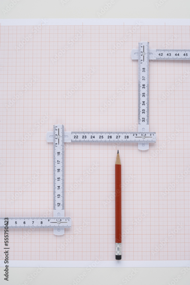 Folding Ruler, Pencil and Graph Paper Stock Photo | Adobe Stock