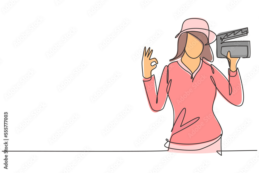 Single one line drawing female film director with gesture okay holding ...