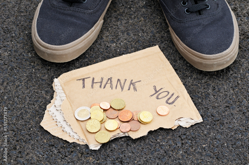 Feet with Spare Change and Thank You Sign Stock Photo | Adobe Stock
