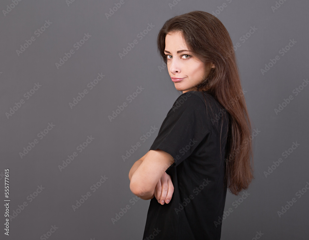 Puzzled doubt thinking unhappy brunette woman pouted her lips with ...