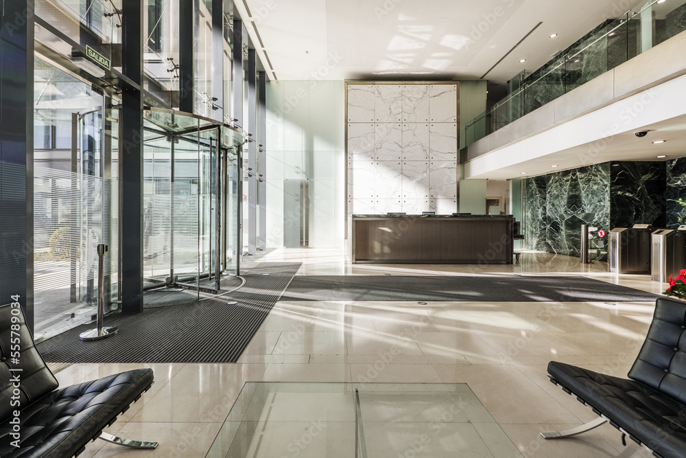 Atrium of an office building with green marble tiled walls, cream ...