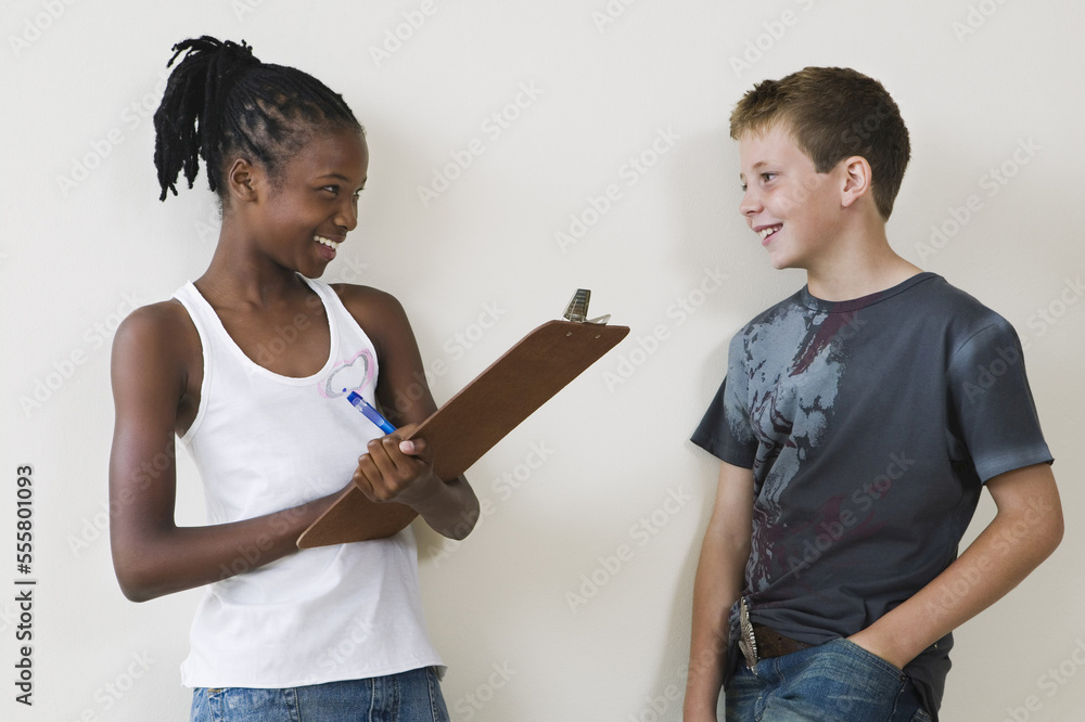 Girl Asking Boy Survey Questions Stock Photo | Adobe Stock