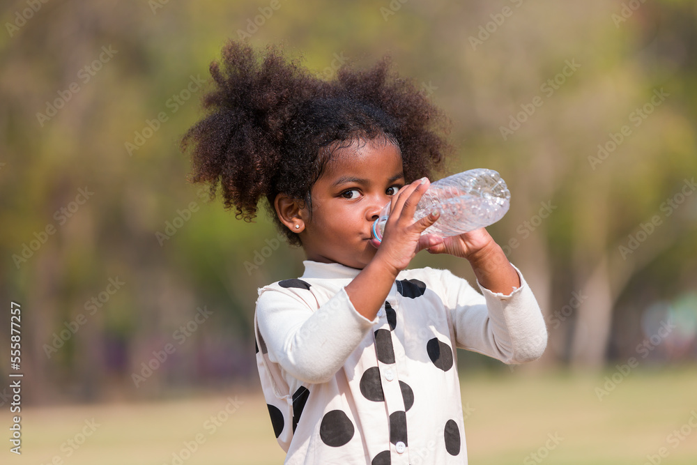 Black Kid Drinking Water