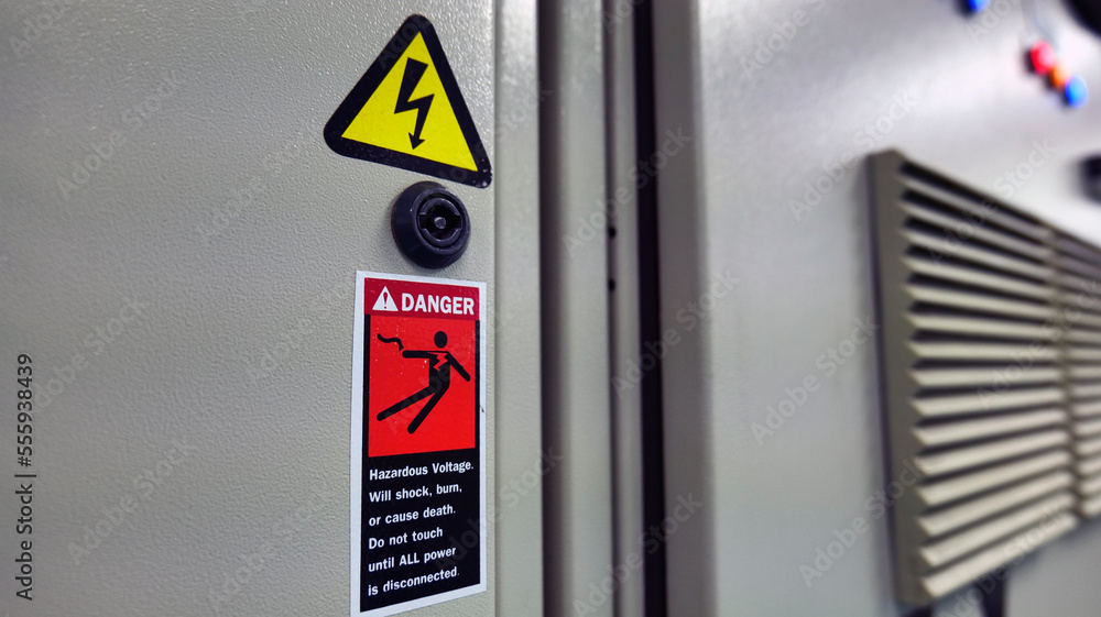 Warning signs, be careful of electric shocks attached to the electric ...