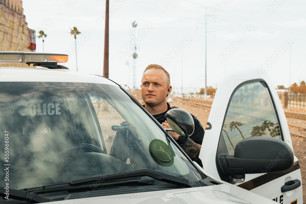 Horizontal image of white male caucasian police officer standing in the ...