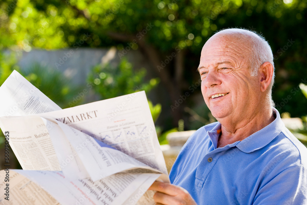 Man Reading Newspaper Stock Photo | Adobe Stock