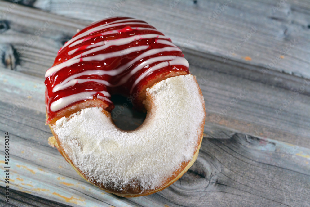 Icing powdered confectioners' sugar and Strawberry flavored ring donut ...