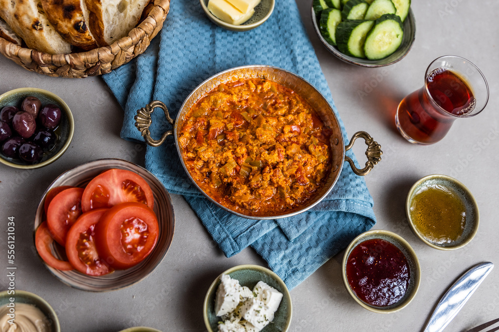 Turkish breakfast served with side dishes and menemen scrambled eggs in ...