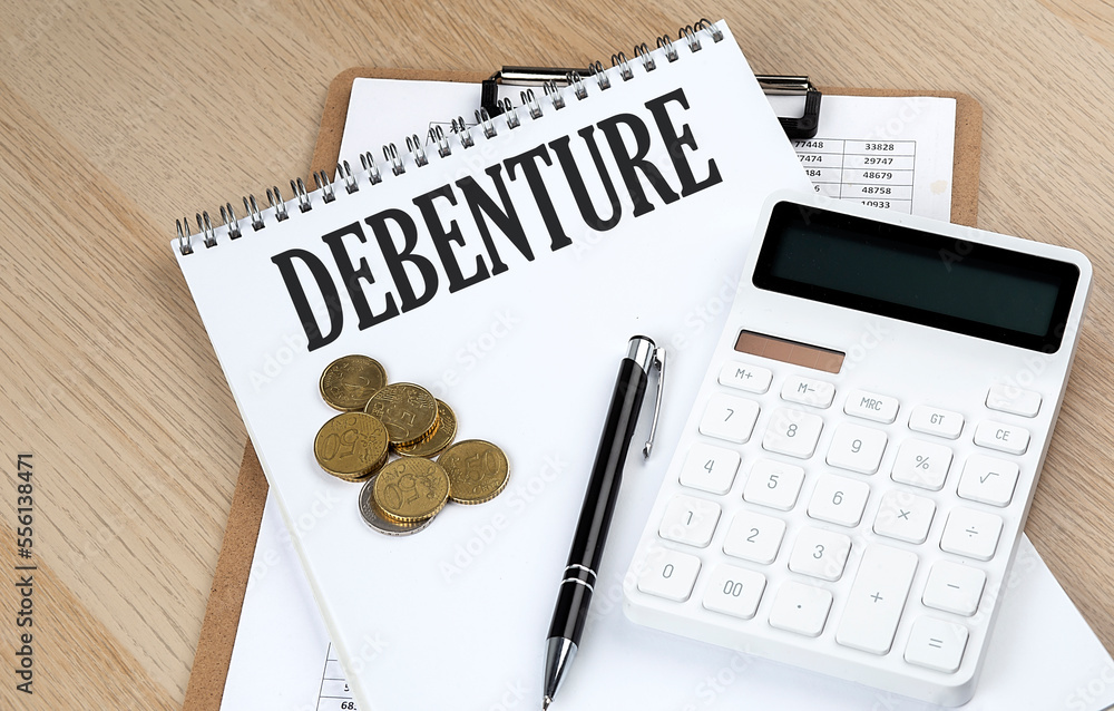DEBENTURE text with chart and calculator and coins , business concept ...