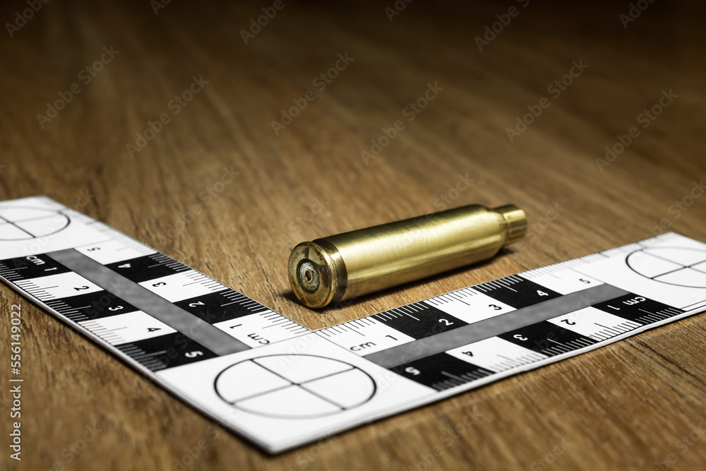 Crime Scene Investigation - bullet casing as a piece of evidence placed ...