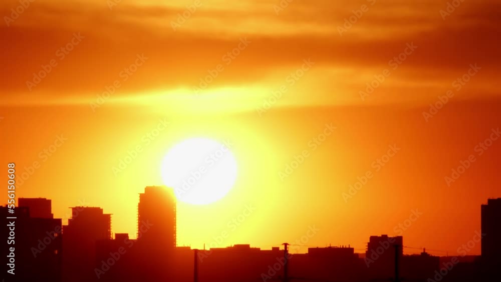 City skyline hot cinematic sunset, downtown cityscape lit with large ...