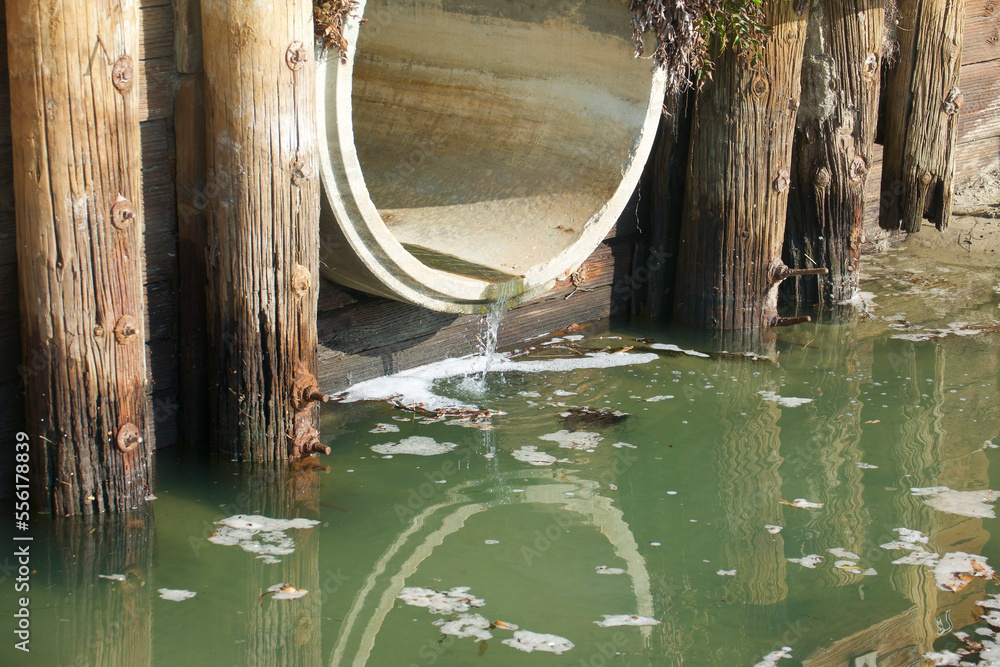 water pollution from sewer pipe draining into the lagoon Stock Photo ...