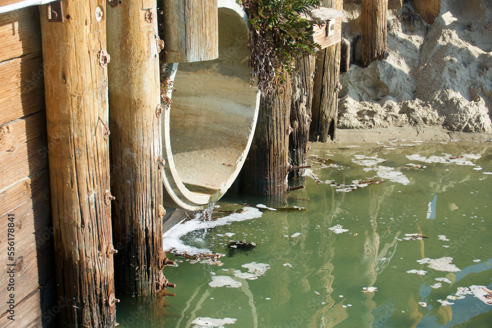 water pollution from sewer pipe draining into the lagoon Stock Photo ...