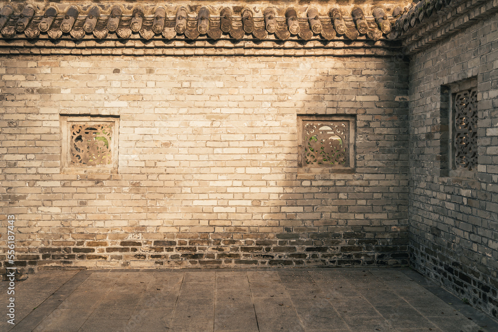 rising sun shines on traditional chinese wall architecture building at ...