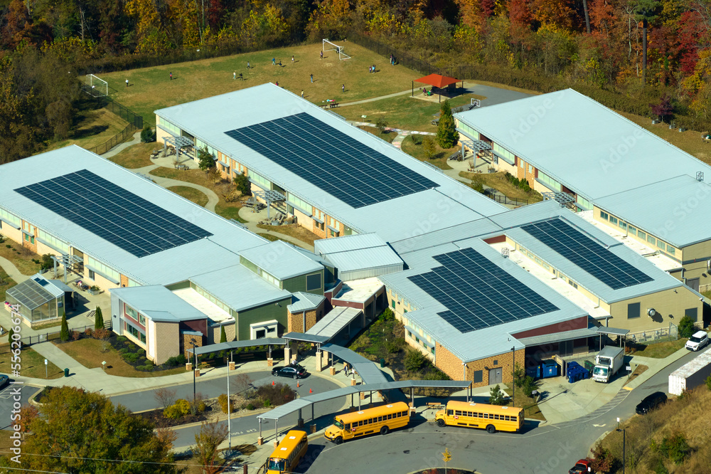 Aerial view of american school building with rooftop covered with ...