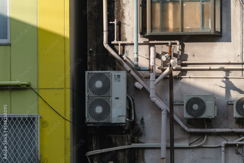 Windows and air conditioning units in an old Japanese building Stock ...