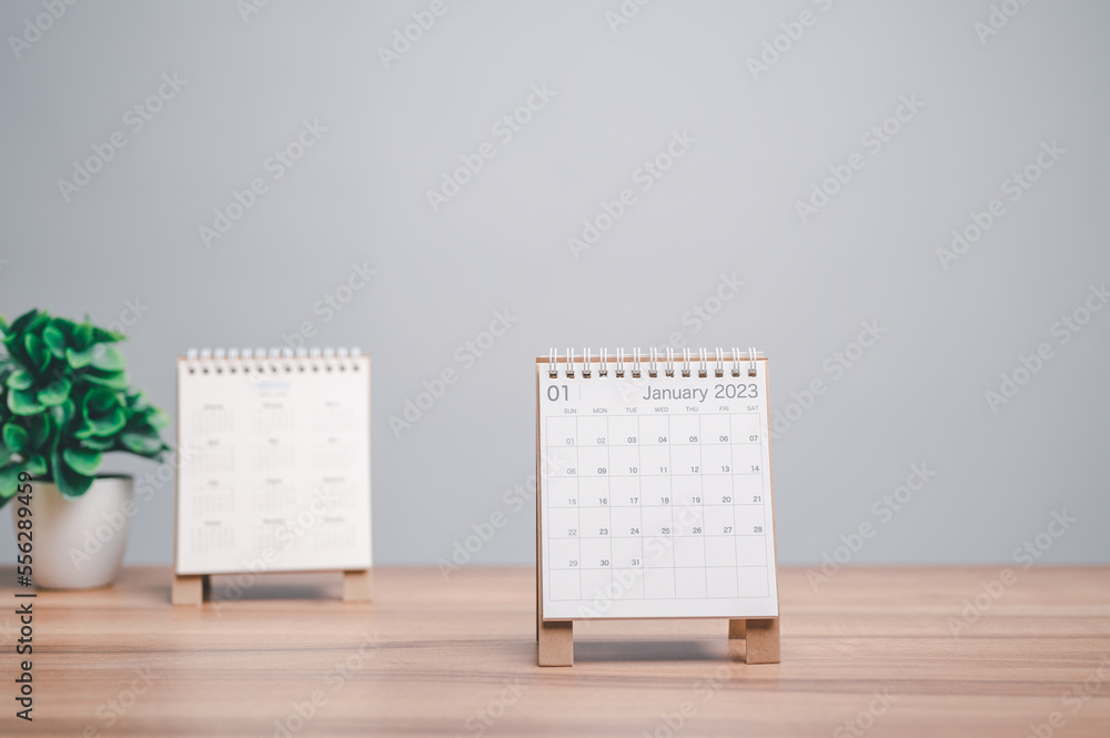 Desktop calendar for 2023 on a desk beige and white background. plans ...