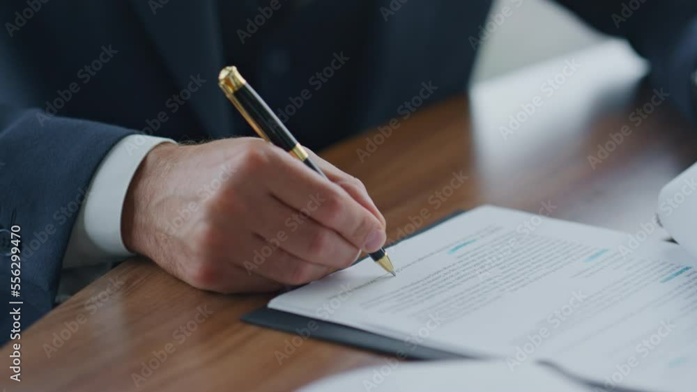 Investor signing business papers in office close up. Man ceo concluding ...