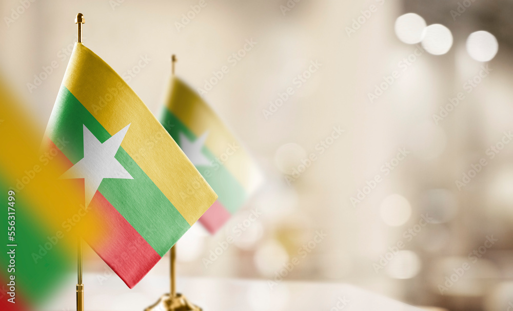 Small flags of the Myanmar on an abstract blurry background Stock Photo ...
