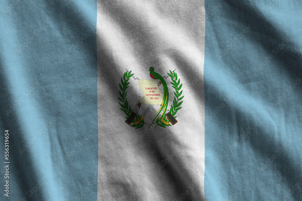 Guatemala flag with big folds waving close up under the studio light ...