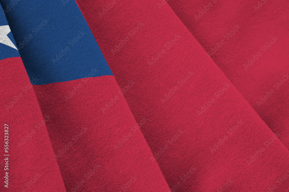 Samoa flag with big folds waving close up under the studio light ...